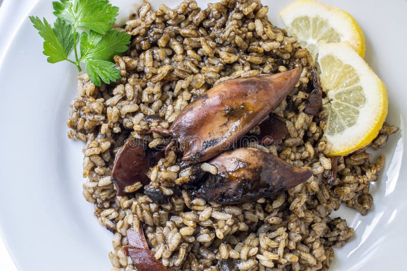 Homemade Rice with Squid on Ink Sauce Stock Photo - Image of healthy ...