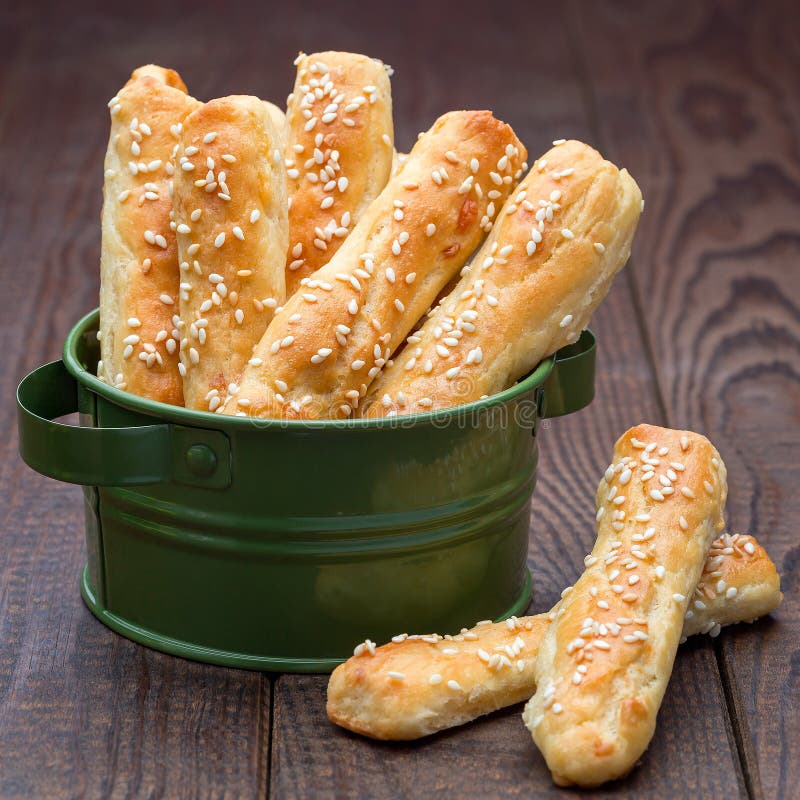 Homemade Savory Bread Sticks with Cheese and Sesame on Wooden Table ...