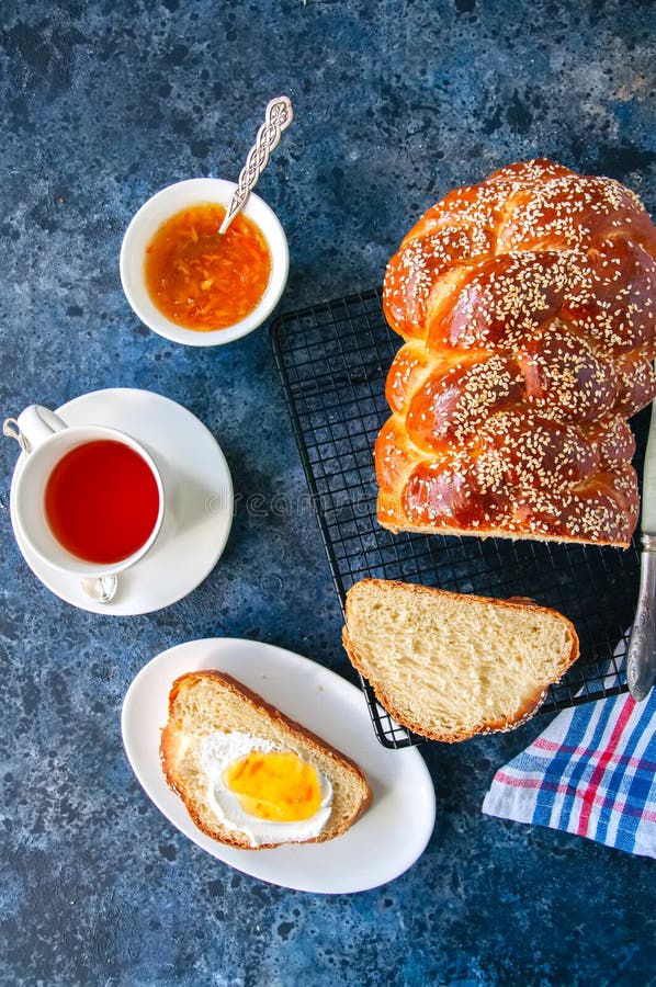 Homemade Sesame Seed Challah Bread and Tea on a Blue Stone Background ...