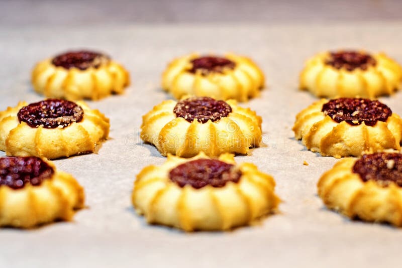Homemade Shortbread Cookies with Jam on Cooking Paper. Background Stock ...