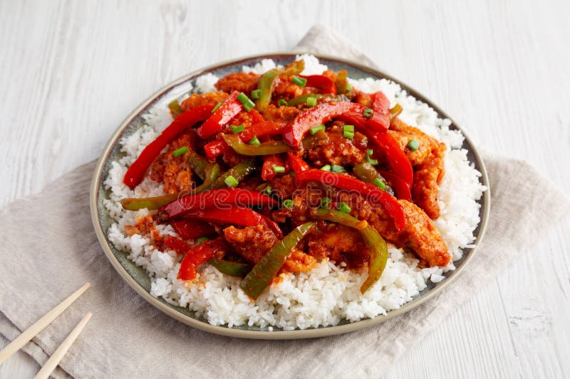 Homemade Simple Chili Chicken with Rice on a Plate, Side View Stock ...