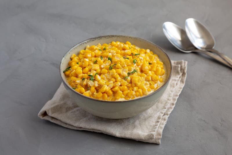 Homemade Slow Cooker Creamed Corn in a Bowl on a Gray Background, Side ...