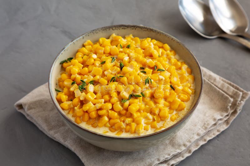 Homemade Slow Cooker Creamed Corn in a Bowl on a Gray Background, Side ...