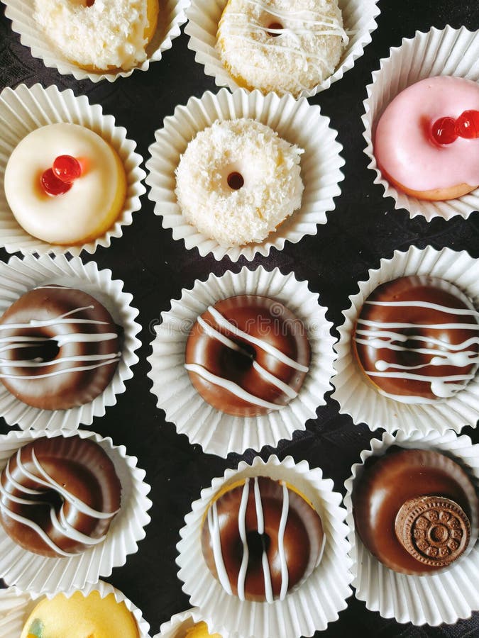 Homemade Small Mini Donuts for Breakfast with Sprinkles and Frosting ...