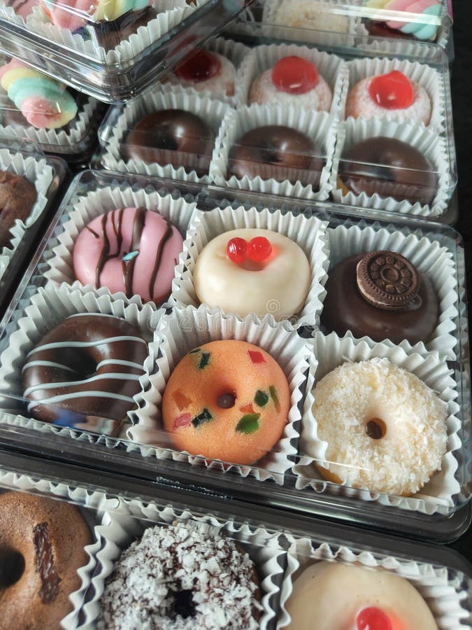 Homemade Small Mini Donuts for Breakfast with Sprinkles and Frosting ...