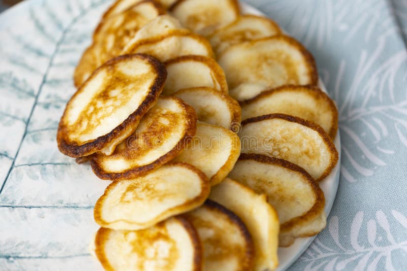 Homemade Small Pancakes on Handmade Light Blue Plate Stock Photo ...