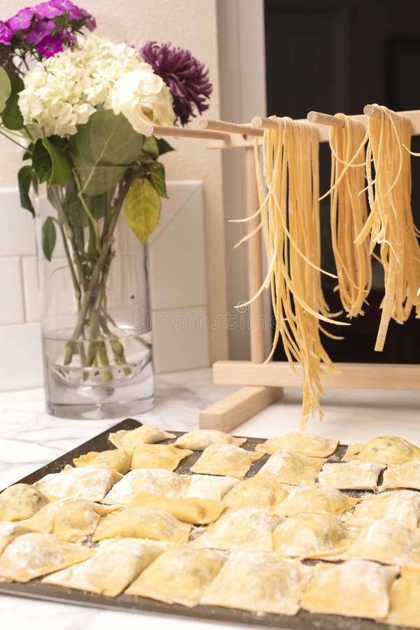 Homemade Spaghetti Drying on a Pasta Rack and Ravioli Ready To B Stock ...