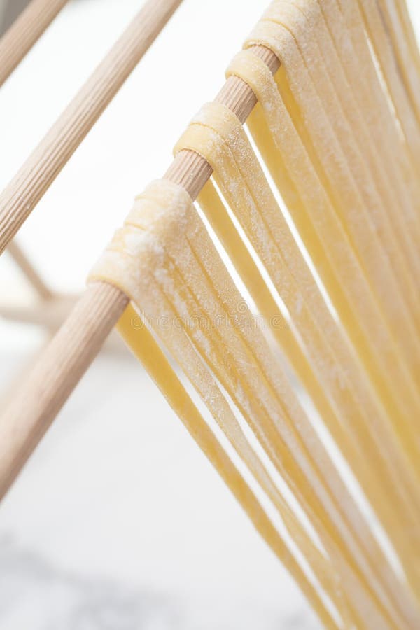 Homemade Spaghetti Drying on a Pasta Rack Stock Photo - Image of ...