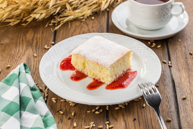 Homemade Sponge Cake with Jam and Cup of Tea on Wooden Table Stock ...
