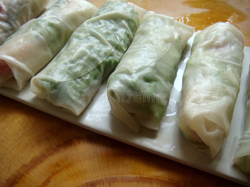 Homemade Spring Rolls on a Flat Plate on a Wooden Table. Stock Image ...