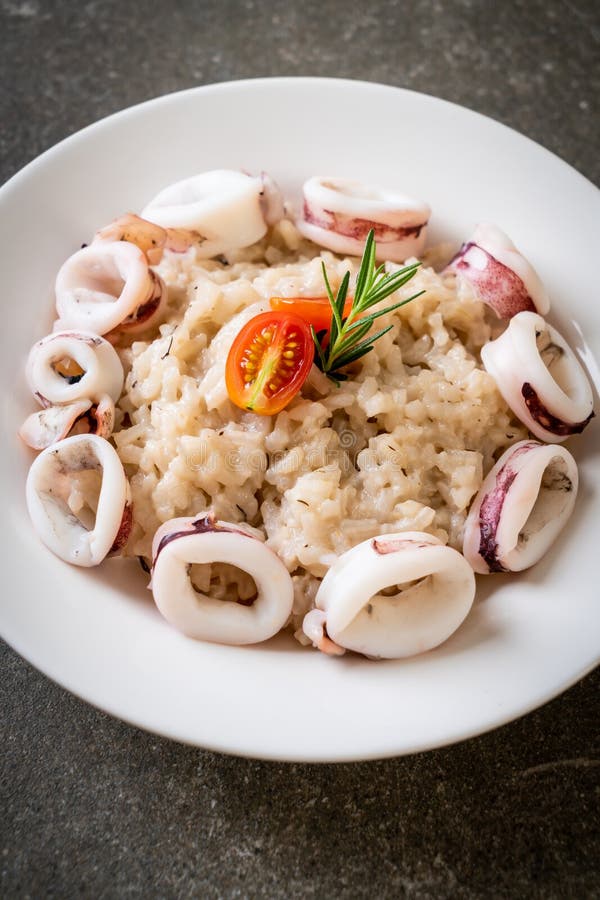 Squids or octopus risotto stock image. Image of cherry - 156317857