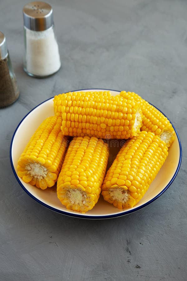 Homemade Steamed Corn on the Cob with Butter on a Plate, Side View ...