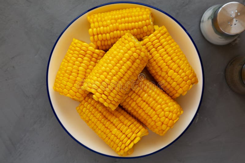 Homemade Steamed Corn On The Cob With Butter On A Plate Top View Flat Lay Overhead From