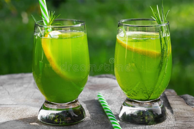 Homemade Summer Refreshing Tarragon Lemon Drink on Patio Table Stock ...