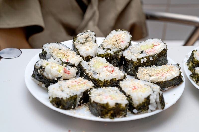 Homemade Sushi, Cut into Pieces, are on the Plates Stock Image - Image ...