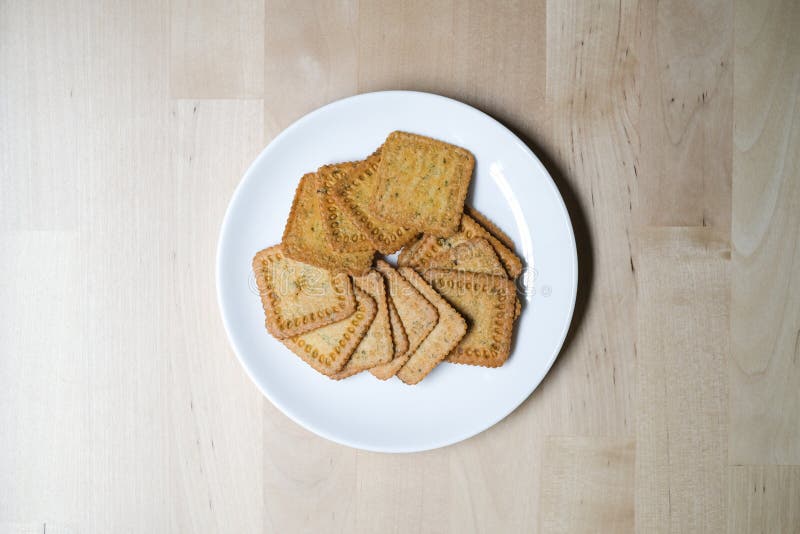 Homemade Thin Crispy Crackers on White Plate Stock Image - Image of ...