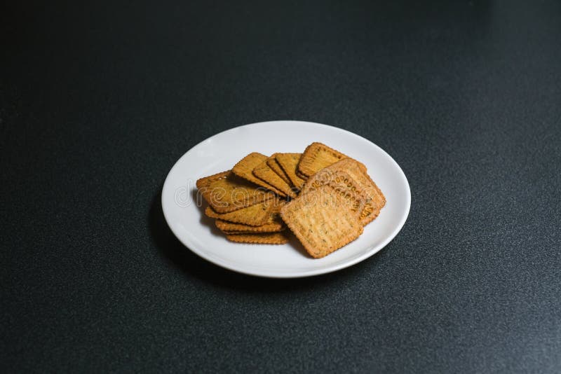 Homemade Thin Crispy Crackers on White Plate. Stock Image - Image of ...