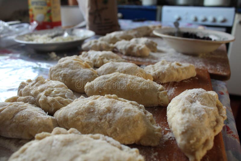 Homemade Ugly Dumplings Lie on a Board Sprinkled with Flour Stock Photo ...