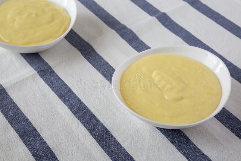 Homemade Vanilla Custard Pudding in White Bowls, Side View Stock Photo ...