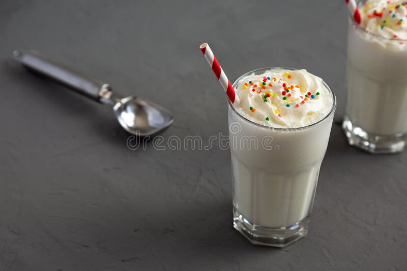Homemade Vanilla Milk Shake with Whipped Cream, Side View Stock Photo ...