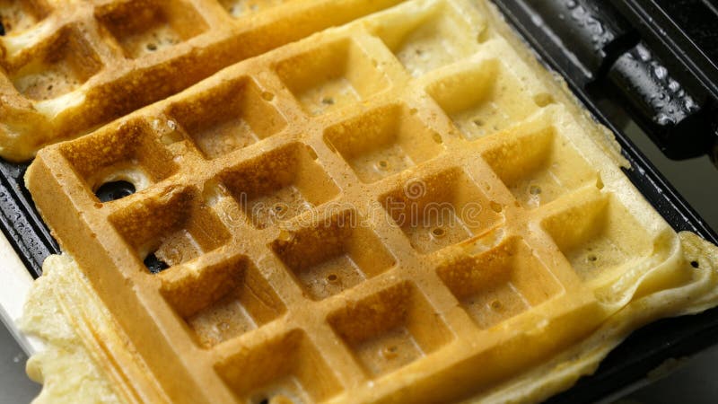 A Homemade Waffle Finished Baking on a Waffle Iron Stock Image - Image ...