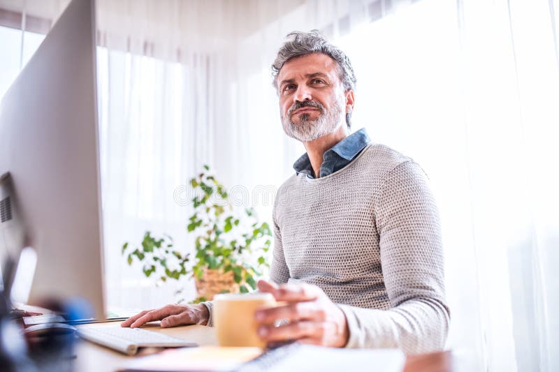Homeoffice for Handsome Man. Man Drinking Coffee in the Morning ...
