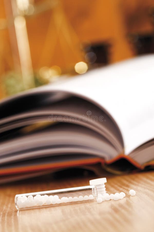 Homeopathic Remedy in Front of Homeopathic Book, Close-up Stock Photo ...