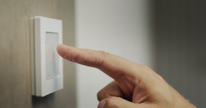The Homeowner Regulates the Temperature in the House on the Electronic ...