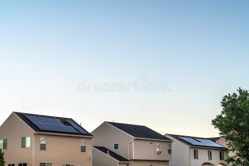 Homes with White Horizontal Siding on Wall and Solar Panels on the ...