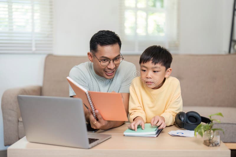 Homeschool Father Teaching Son with Notebook and Laptop Support Stock Photo - Image of ...