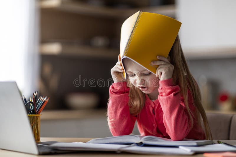 Homeschooling Problems. Stressed Little Girl Covering Head with ...