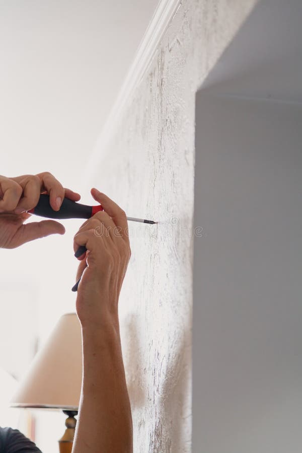 Hands into wall of room stock photo. Image of experience - 184386376