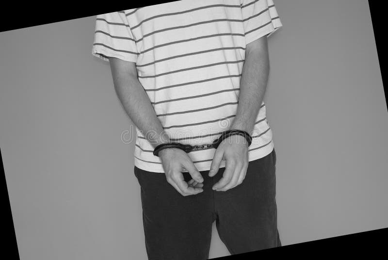 Homme avec des menottes photo stock. Image du police, flic - 1765116