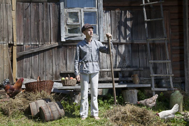 Homme De Campagne Avec Une Fourche Image stock - Image du caractères ...