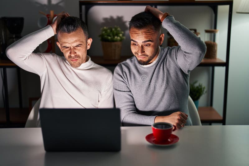 Homosexual Couple Using Computer Laptop Confuse and Wondering about ...