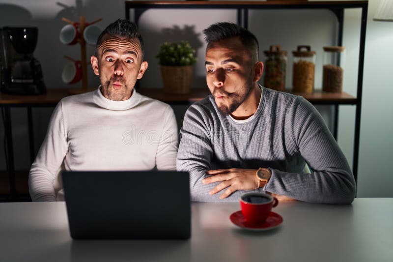 Homosexual Couple Using Computer Laptop Making Fish Face with Lips ...