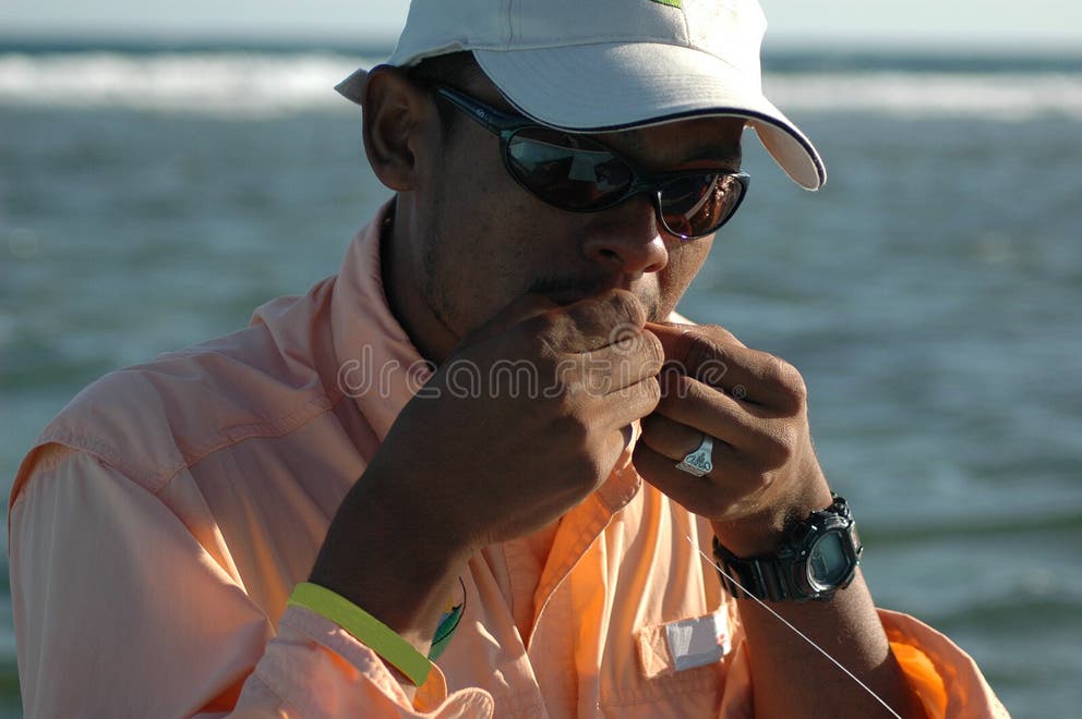 Honduran Guide Attaching Fly with Teeth Stock Image - Image of lagoon ...