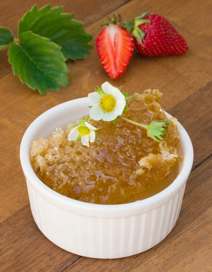 Honey in the Comb and Strawberries Stock Photo - Image of comb, gold ...