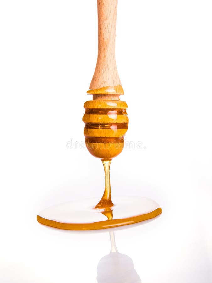 Honey Drip from Wooden Dipper on White Background Stock Photo - Image ...