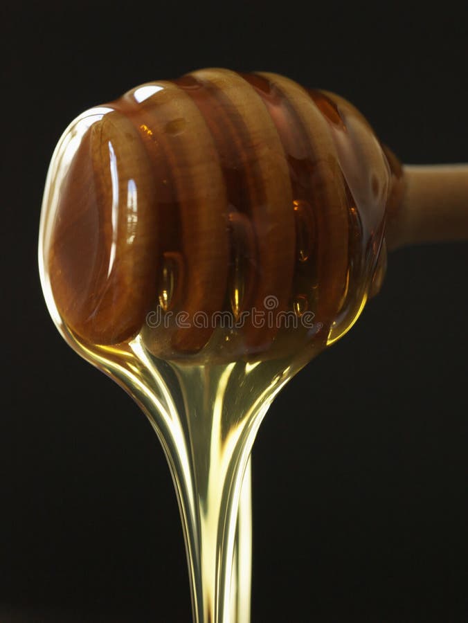 Honey Dripping from a Wooden Honeyspoon Stock Image - Image of ...