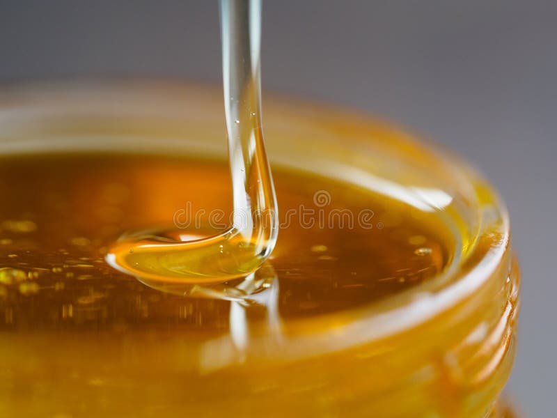 Honey Falling in Jar Extreme Close Up Stock Image - Image of macro ...