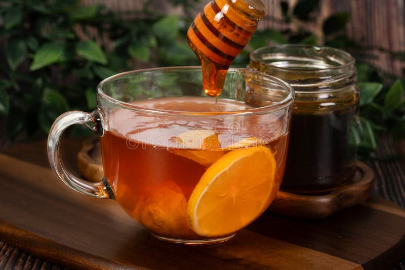 Honey and lemon winter tea stock illustration. Illustration of glass - 363833376