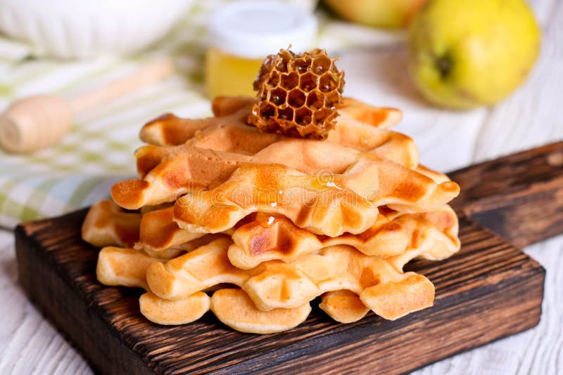 Honey Pouring on a Fresh Waffles. Breakfast with Belgian Waffles Stock ...