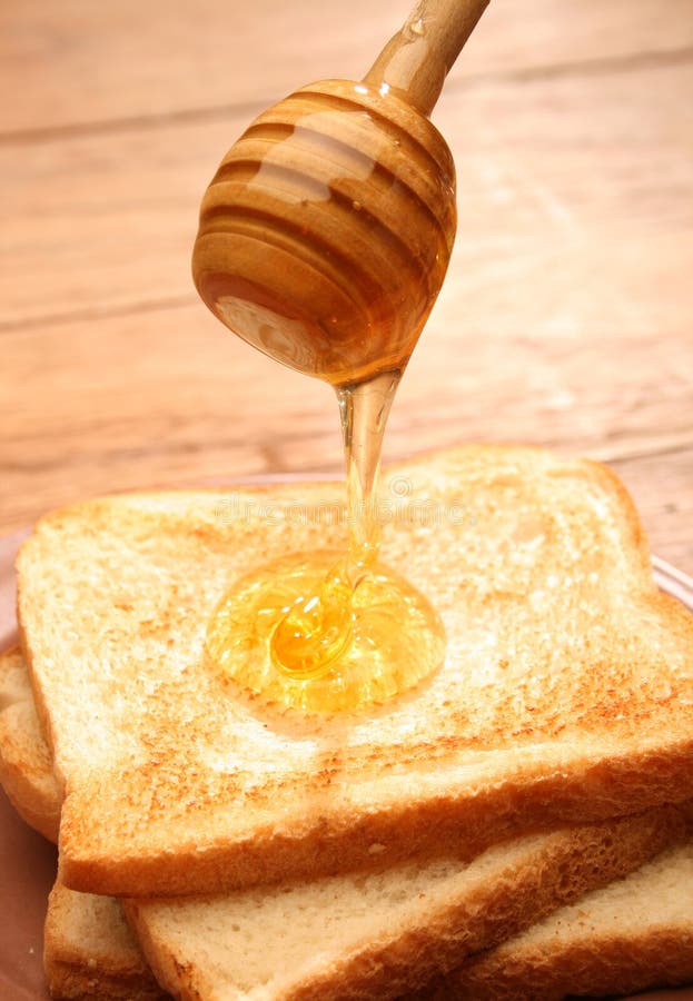 Honey Pouring Over Toast Bread Stock Photo - Image of honeycomb, gold ...