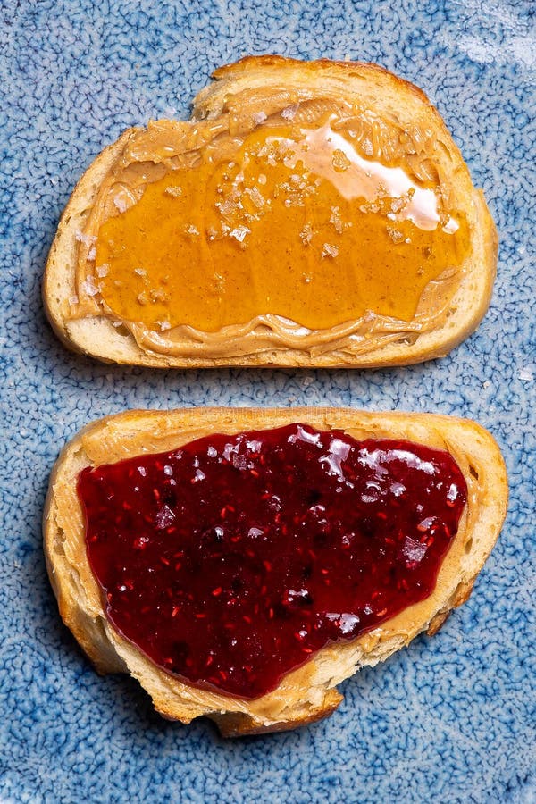 Honey, Raspberry Jam and Peanut Butter on White Bread Close Up Stock ...