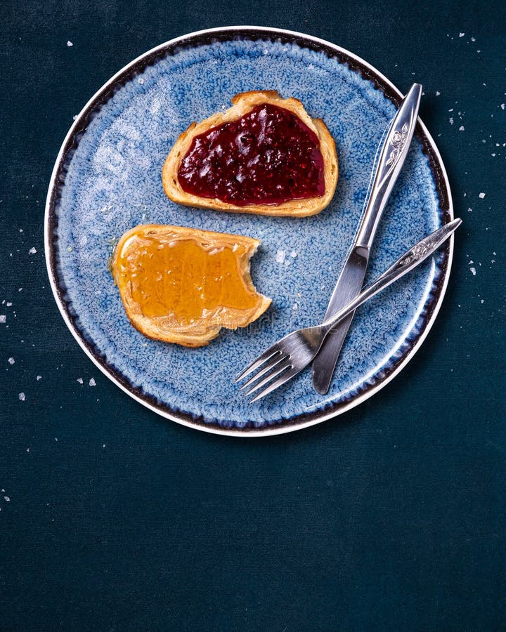 Honey, Raspberry Jam and Peanut Butter on White Toast Stock Photo ...