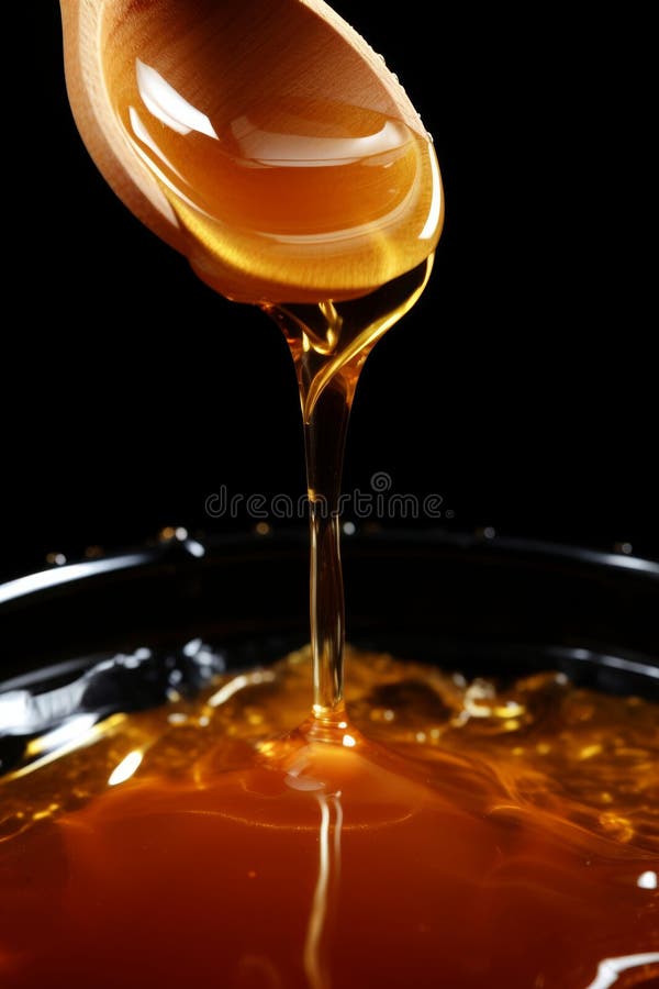 Honey Spoon Dripping into Aromatic Tea Cup, Creating Beautiful Patterns ...