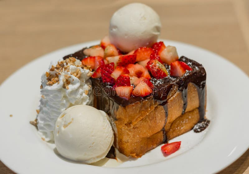 Honey Toast with Chocolate Lava and Strawberry Stock Photo - Image of ...