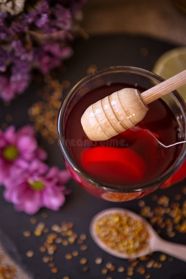 Honey from Wooden Dipper on Cup of Tea Stock Image - Image of close ...