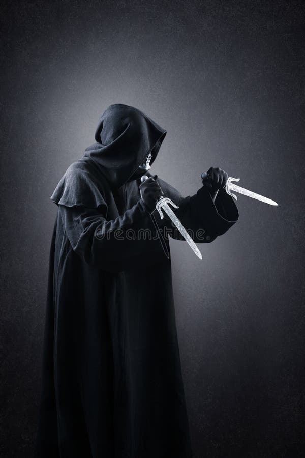 Hooded Assassin with Two Daggers in the Dark Stock Image - Image of ...